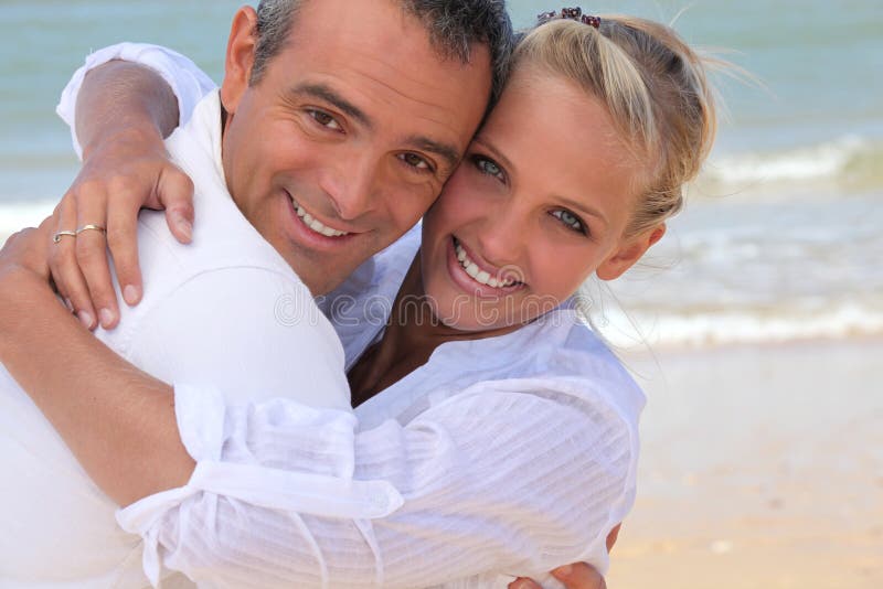 Couple Hugging on the Beach Stock Photo - Image of relationship ...