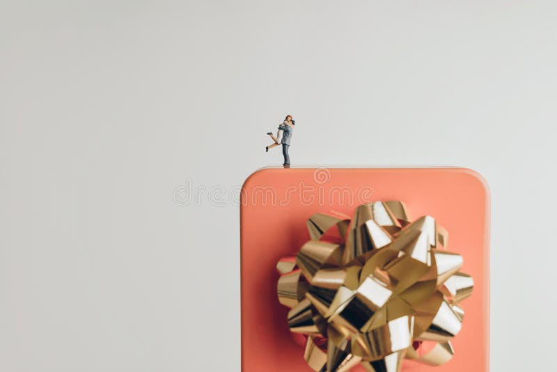 Couple Hugging on a Giant Gift Box Stock Image - Image of giant ...