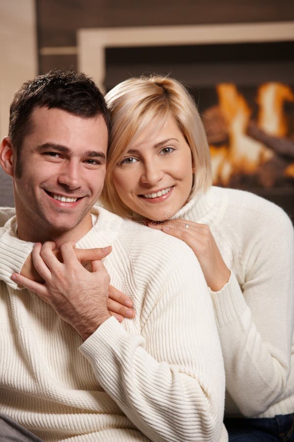 Couple hugging home stock photo. Image of blanket, fireplace - 11677452