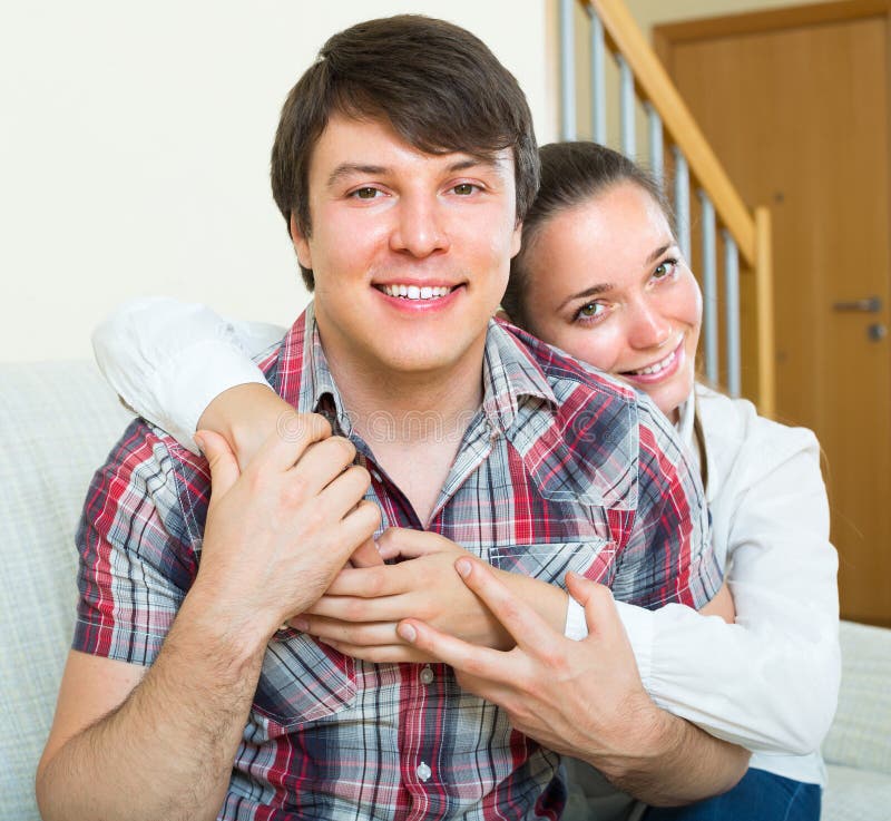 Couple hugging at home stock photo. Image of flat, lovely - 68820132
