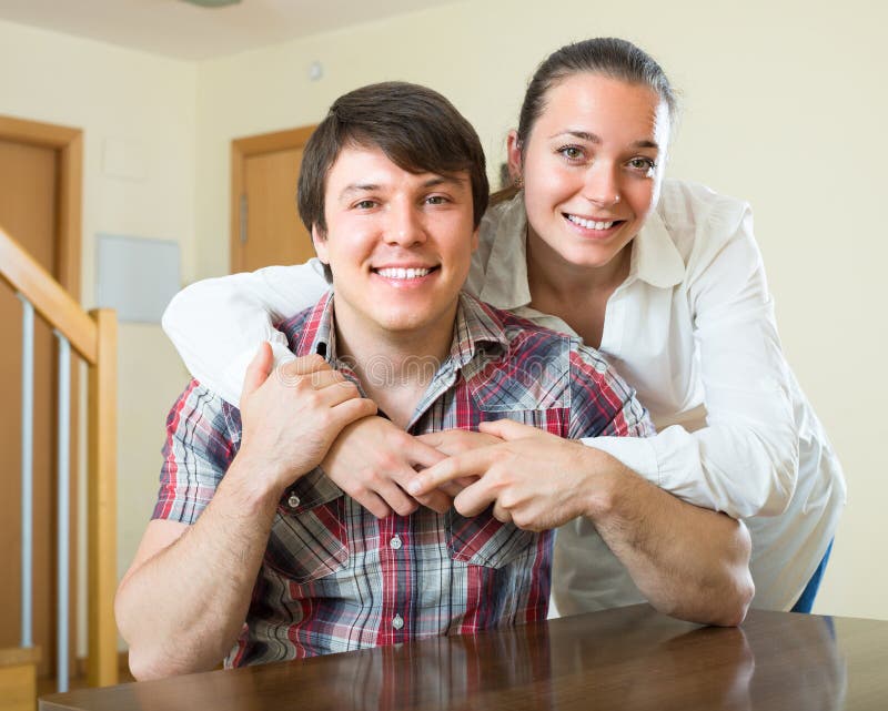 Couple hugging at home stock image. Image of embracing - 56858225
