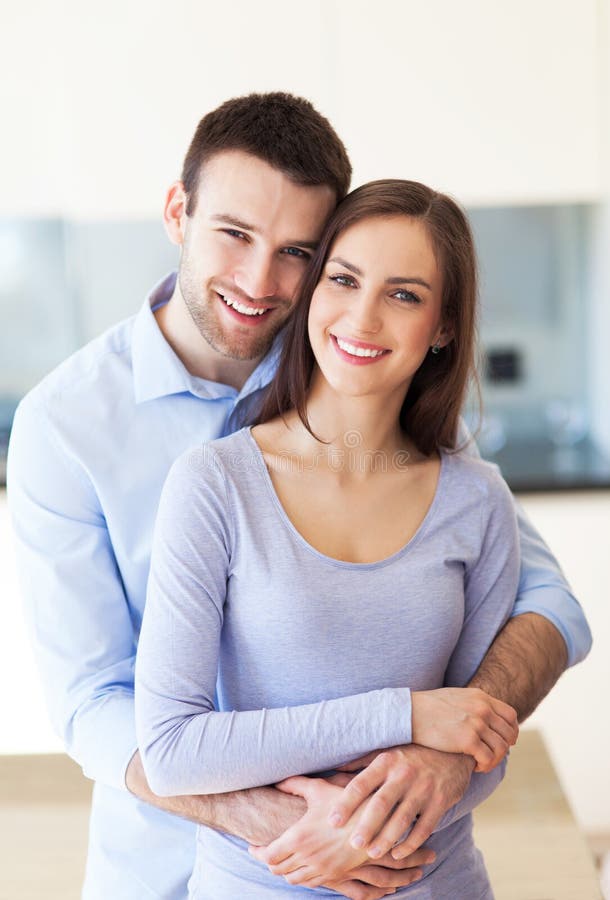 Couple hugging at home stock photo. Image of carefree - 30551618
