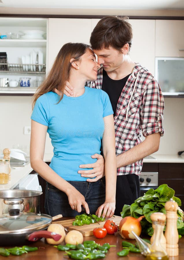 Couple Hugging In The Kitchen Stock Photo - Image: 39997530