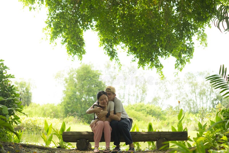 Couple Hugging among Nature in the Garden. Happiness Time for Co Stock ...