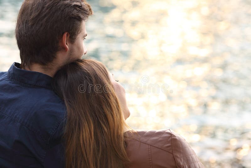 Couple Hugging and Watching Sunset on the Beach Stock Image - Image of ...