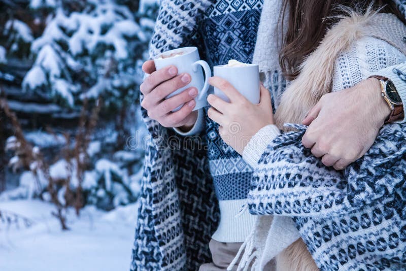 Couple Hugs and Holds Cups of Coffee with Marshmallow Stock Photo ...