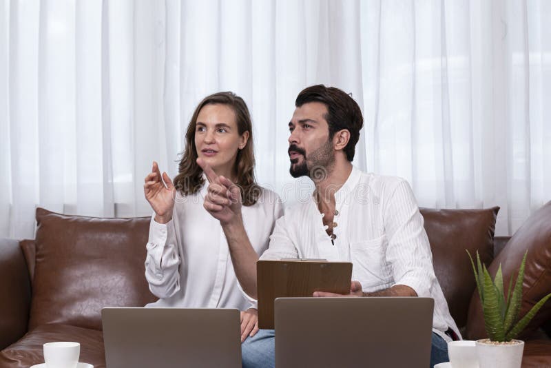 Couple Husband and Wife Talking Using Computer Sit on Sofa Deciding on ...