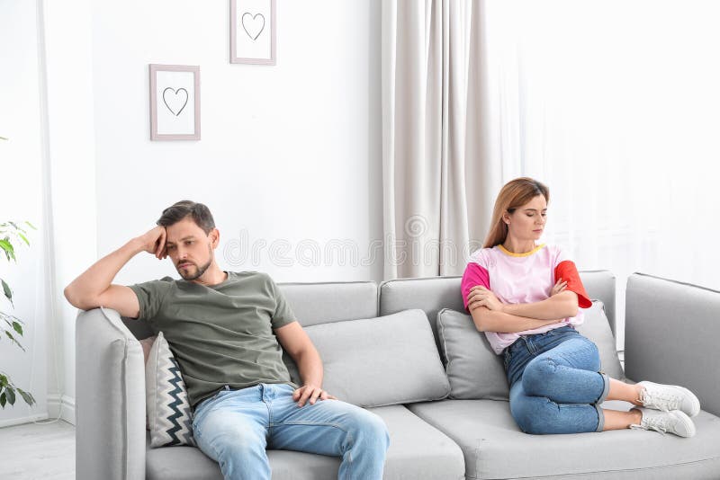 Couple Ignoring Each Other after Argument in Living Room. Stock Photo ...