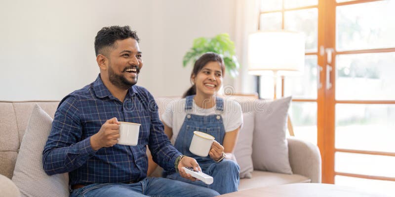 Couple Indian Watching Television while Man Using Remote Control Stock ...