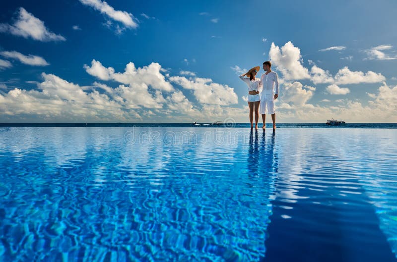 Couple at the poolside stock image. Image of stand, honeymoon - 89235213