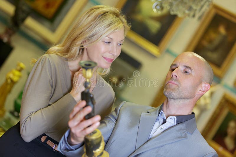 Couple inspecting antique stock image. Image of inheritance - 315973717