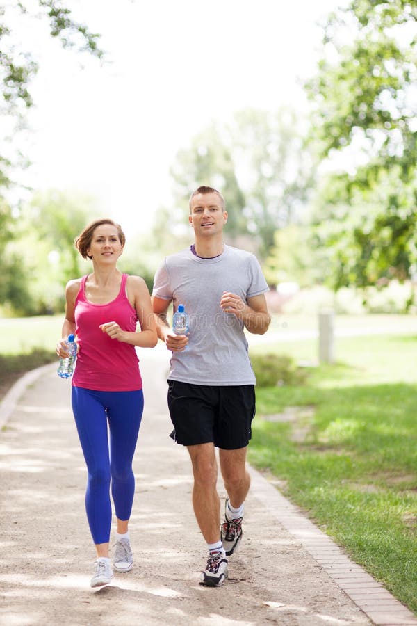 Athletic and Fit African American Couple - Jogging in a Park Stock ...