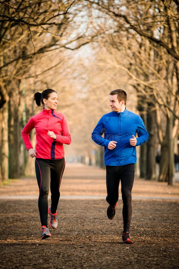 Couple jogging together stock image. Image of blue, runner - 40003879