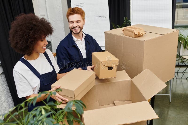Couple Joyfully Packing and Unpacking Boxes Stock Photo - Image of ...