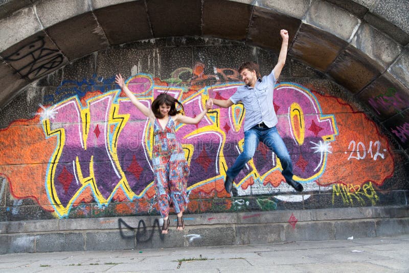 Couple Jumping Off the Ledge Editorial Stock Image - Image of ...