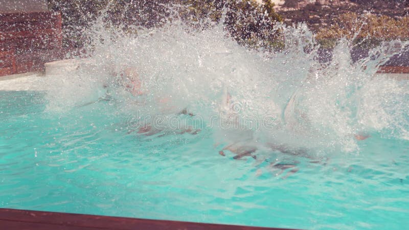 Couple Jumping into Swimming Pool Holding Hands Stock Footage - Video ...