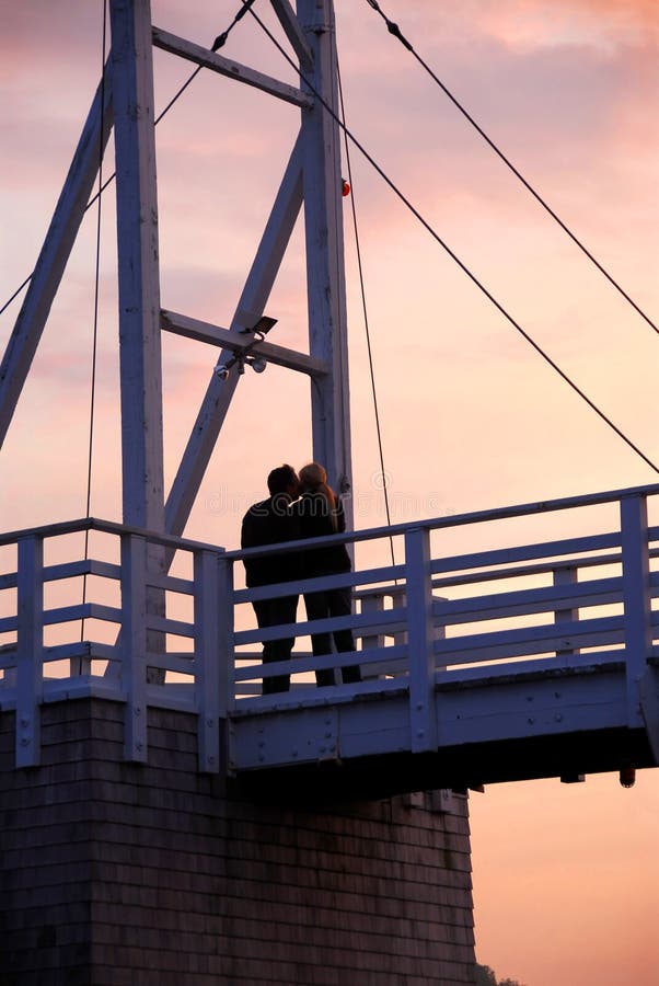 Couple kissing on a bridge stock photo. Image of love, couple - 968350