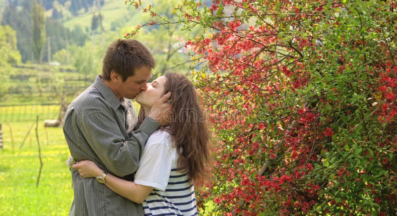 Couple kissing in spring l stock photo. Image of caucasian - 111618898