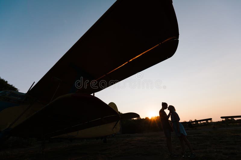 Couple Is Kissing Under The Vintage Plane Stock Image - Image of ...