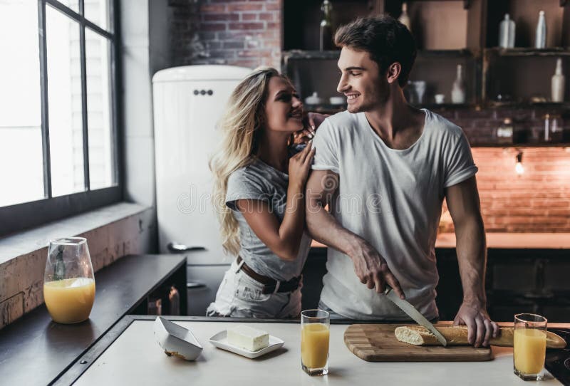 Couple on kitchen stock photo. Image of handsome, beautiful - 96260976