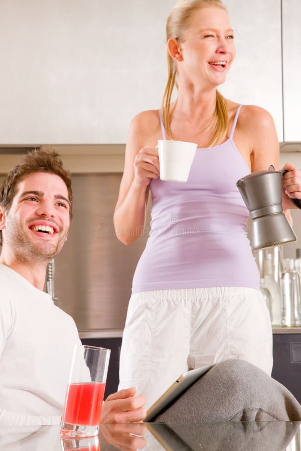 Couple in Kitchen Having Breakfast Stock Image - Image of couple ...