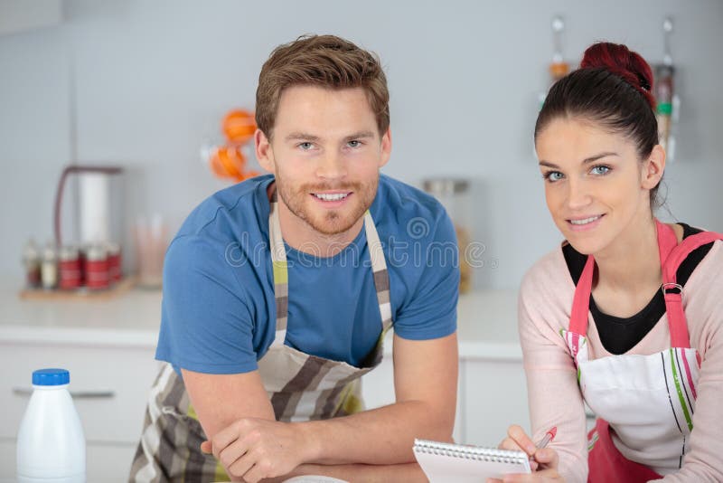 Couple in kitchen posing stock image. Image of couple - 93833875