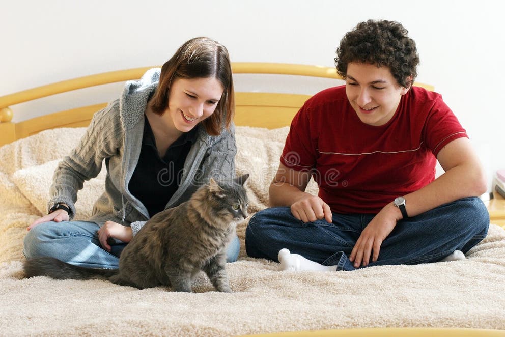 Couple with a kitten stock image. Image of boyfriends, home - 417589