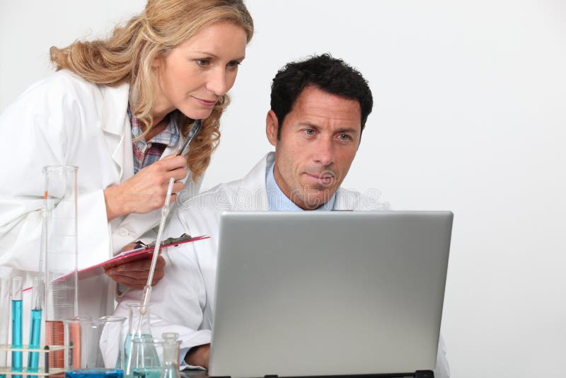 Couple in laboratory stock image. Image of concentrating - 27226641