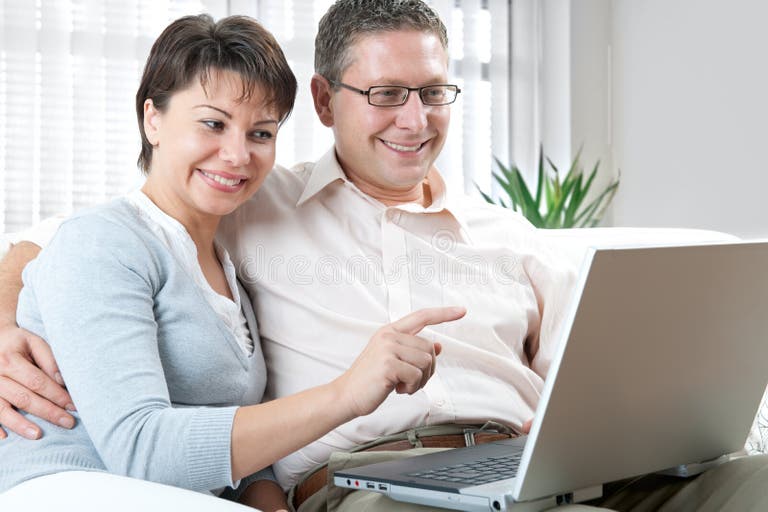 Couple on laptop stock photo. Image of lifestyle, male - 11921538