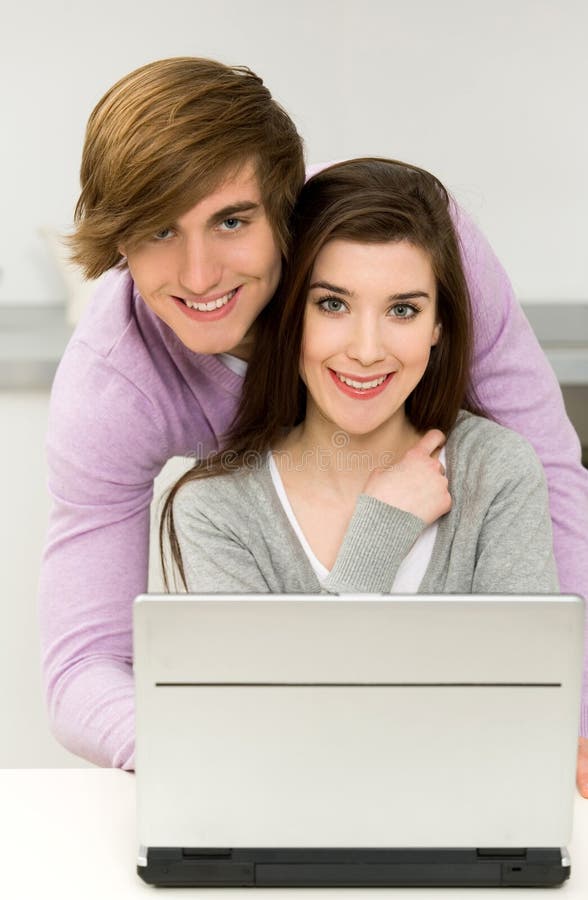 Couple using Laptop stock image. Image of notebook, internet - 771821