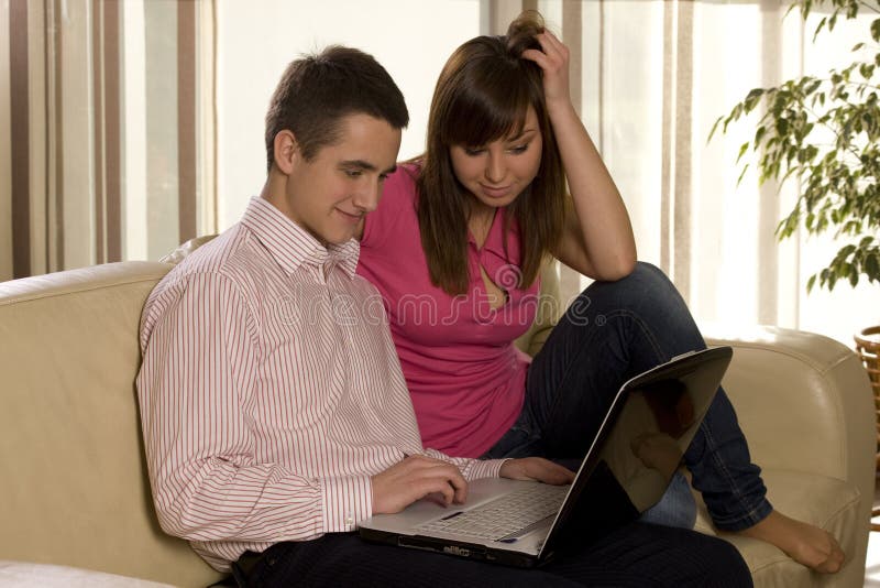 Couple with Laptop stock photo. Image of smiling, cheerful - 14550932