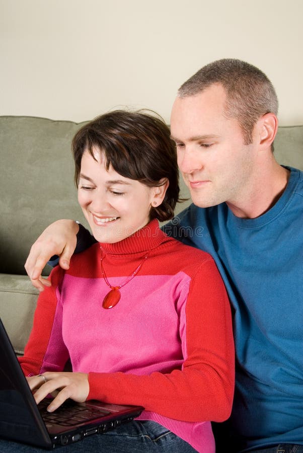 Couple on laptop stock photo. Image of businesswoman, livingroom - 1491924