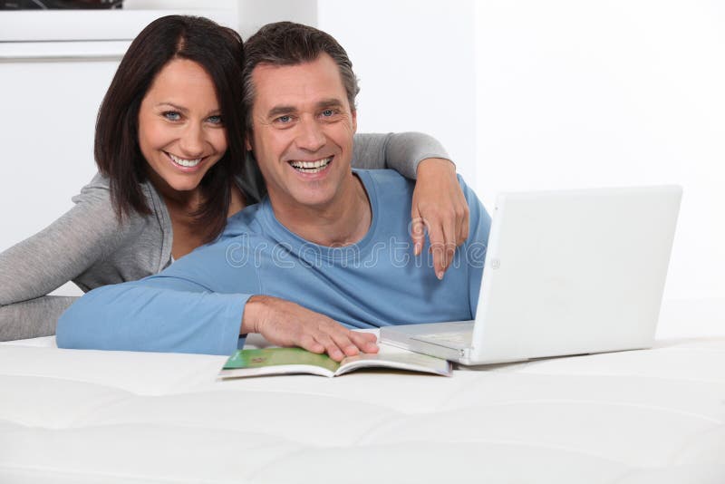 Couple with a Laptop Computer Stock Photo - Image of teenagers, couple ...