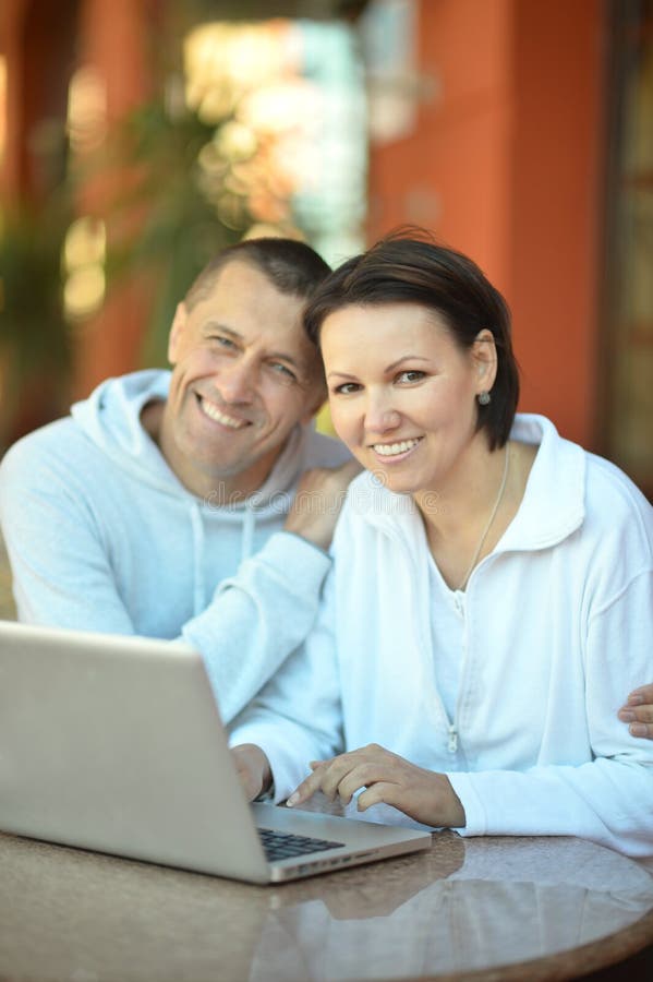 Couple with laptop stock photo. Image of healthy, lady - 50854884