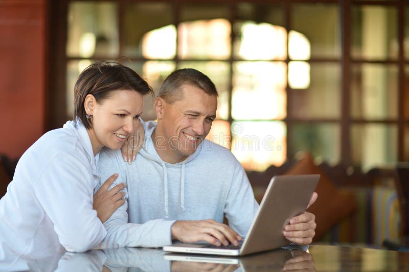 Couple with laptop stock image. Image of smile, couple - 50994977