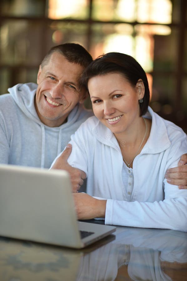 Couple with laptop stock image. Image of caucasian, internet - 53874481