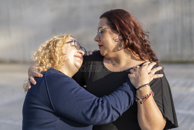 Couple Of Lesbian Women Hugging In A Park Stock Image Image Of