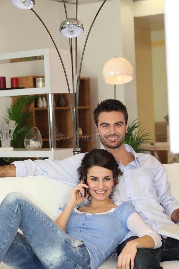 Couple in living-room stock photo. Image of latina, blue - 26466970
