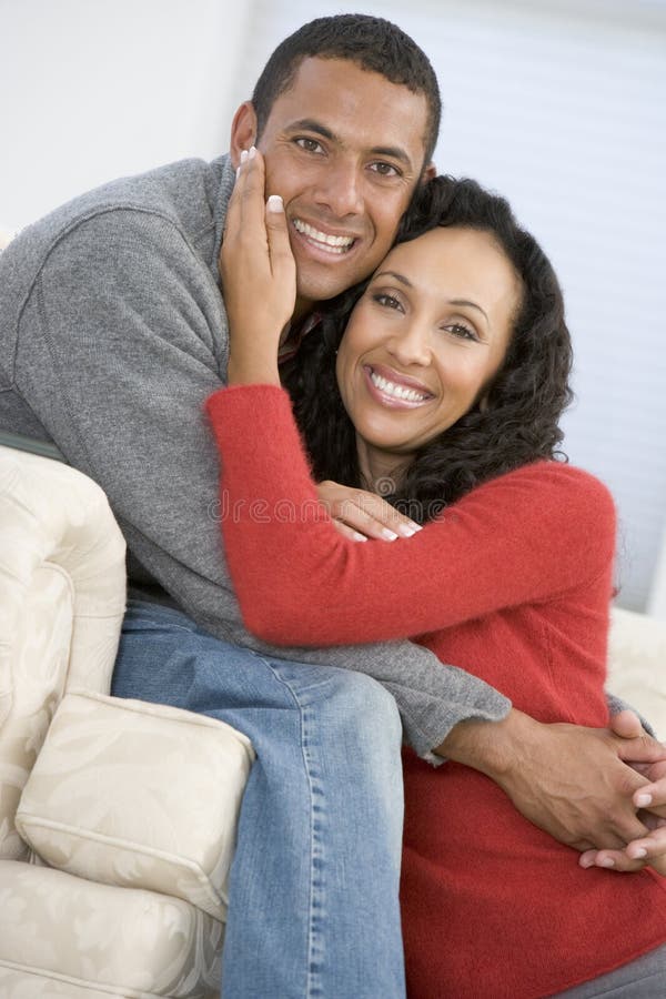 Couple in Living Room Smiling Stock Image - Image of daytime ...