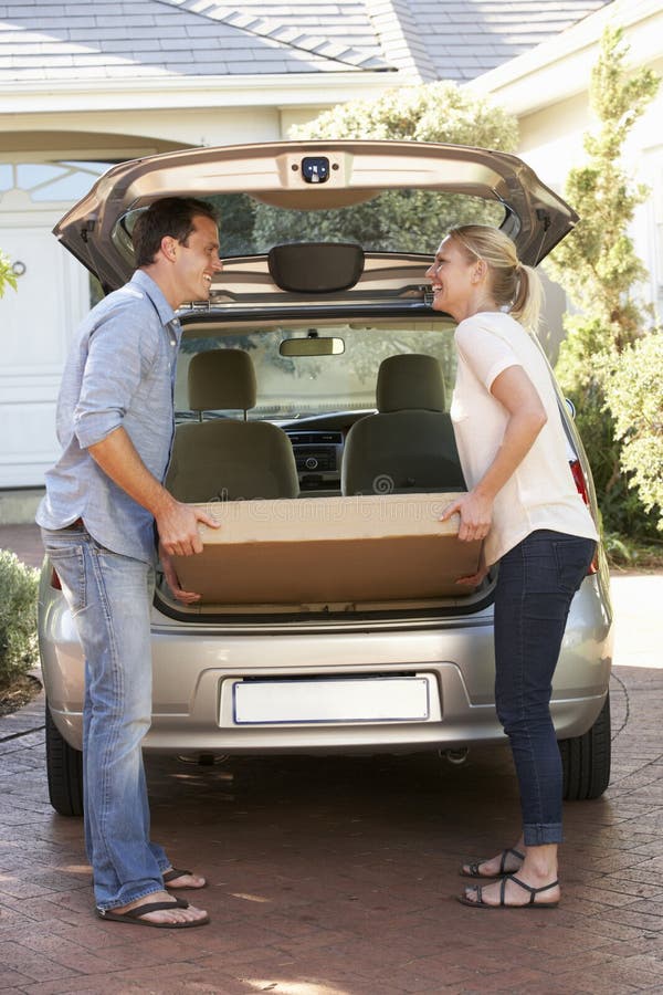 Couple Loading Large Package into Back of Car Stock Image - Image of ...