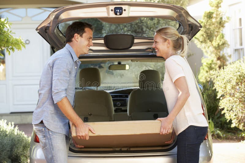 Couple Loading Large Package into Back of Car Stock Image - Image of ...