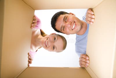 Couple lookin into box stock image. Image of domestic - 6501449