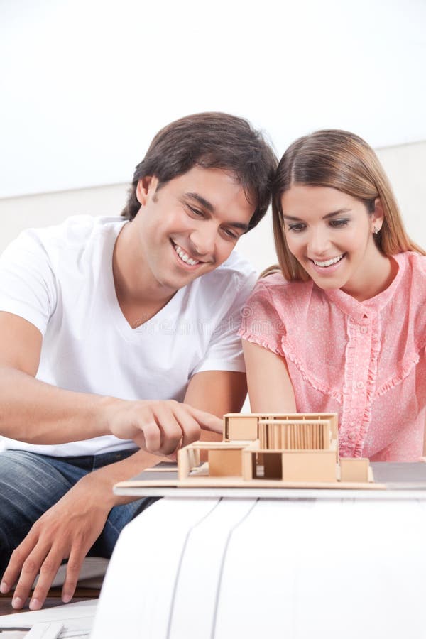 Couple Looking at House Model Stock Photo - Image of couple, building ...