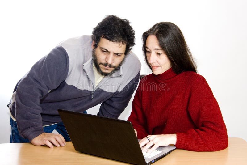 Couple looking at laptop stock photo. Image of laptop - 15348294