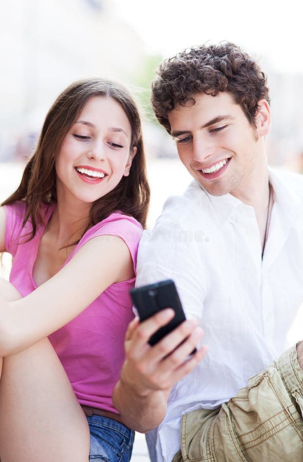 Couple Looking at Mobile Phone Stock Image - Image of technology ...
