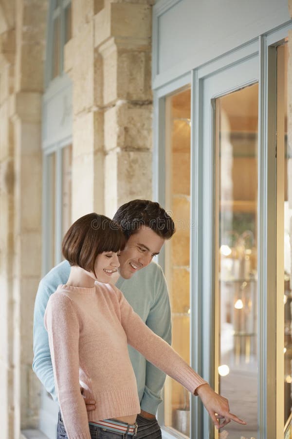 Couple Looking in Shop Window Stock Image - Image of people, love: 31840639