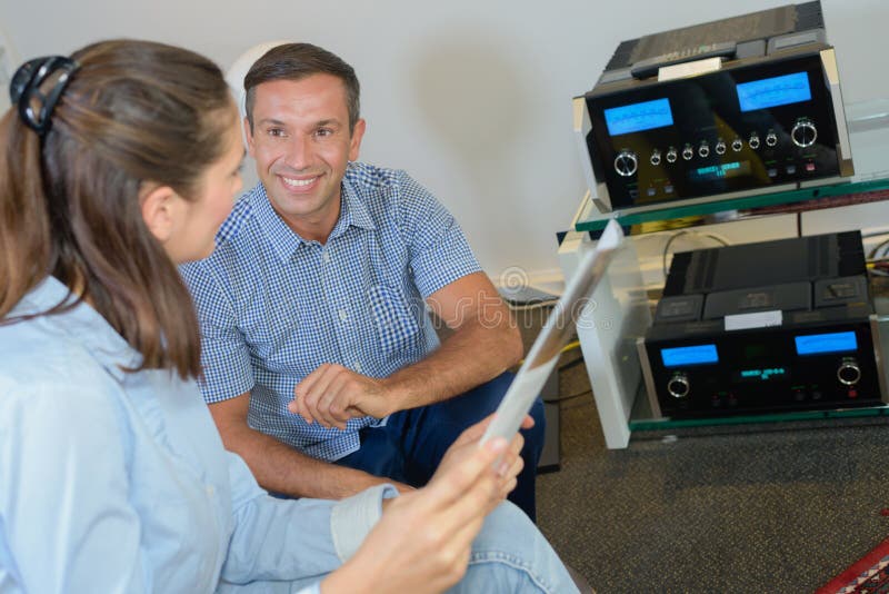 Couple Loooking for Speakers in Store Stock Image - Image of commercial ...