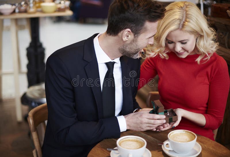Couple in love in cafe stock photo. Image of gift, gesture - 85270106
