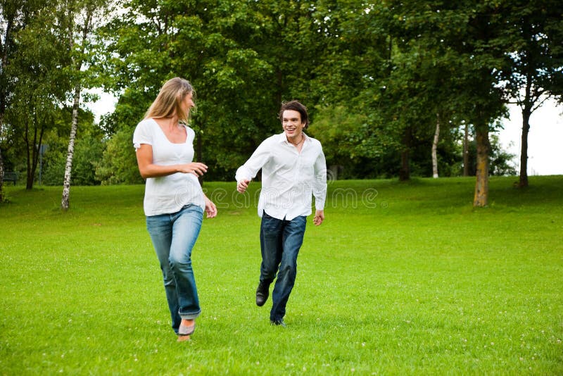 Couple in Love Chasing Each Other Stock Image - Image of running, young ...