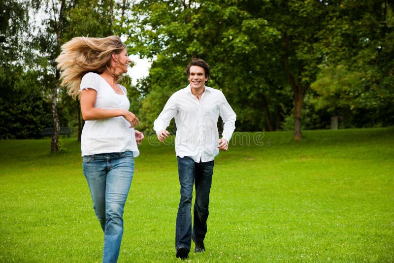 Couple in Love Chasing Each Other Stock Photo - Image of leisure ...